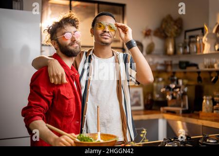 Two guys cooking healthy together at home Stock Photo - Alamy