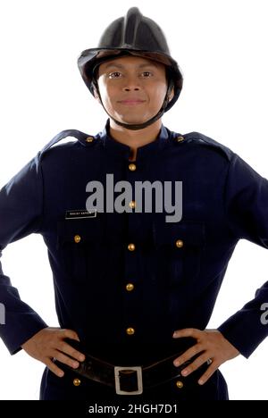 Fireman wearing uniform and hat in studio Stock Photo - Alamy