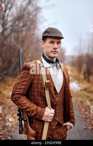 Hunting Clothing for hunter. Handsome confident man. Serious guy posing ...