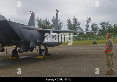 Members from the 389th Fighter Squadron (FS), finish attaching a weapon ...