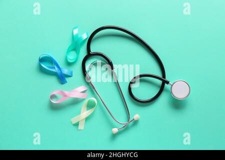 Different awareness ribbons on turquoise background. World Cancer Day ...