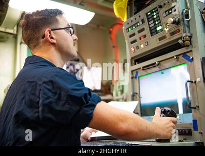 Fire Controlman 2nd Class Eric Matthews, assigned to the Arleigh Burke ...