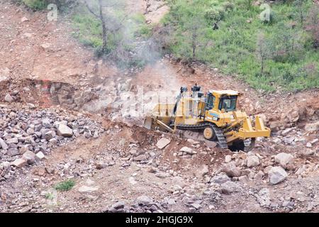 Road work removes the debris from demolition of old derelict with an ...