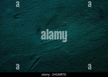 Petrol colored wall background with textures of different shades of ...