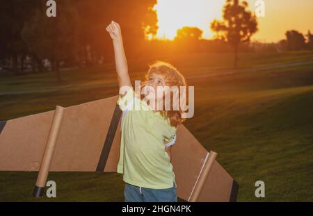 Kid superhero with jetpack. Child pilot play on summer day. Success ...