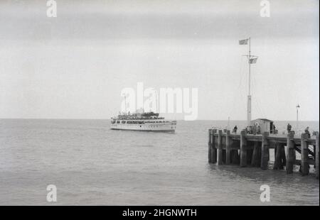 1950s, historical, a distance picture of a steam locomotive and train ...