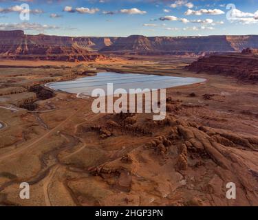 Aerial view of colorful potash ponds amidst majestic rock formations ...