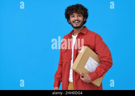 Young indian customer man holding credit card standing over isolated ...