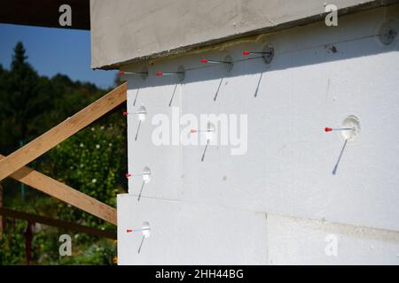 A view at how to insulate the wall with nails and polystyrene Stock ...