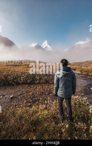 Mount Assiniboine in foggy on autumn forest in the morning at ...