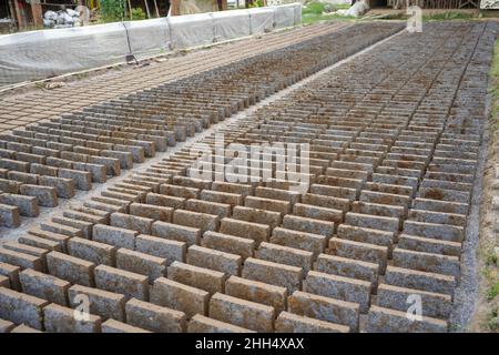 Making bricks from clay. After the clay is molded into bricks, after ...