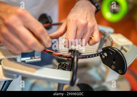 badminton racket repair and weaving Stock Photo - Alamy