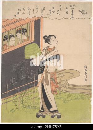 Komuso monk playing a bamboo shakuhachi flute with a woven basket on ...