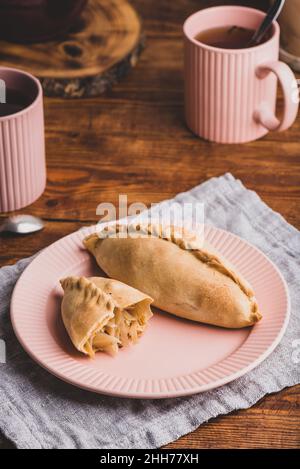 Two Cabbage Hand Pies on Plate Stock Photo - Alamy