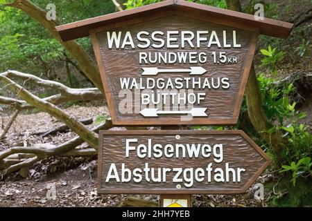 Sign shows waterfall direction and fall hazard warning Stock Photo - Alamy
