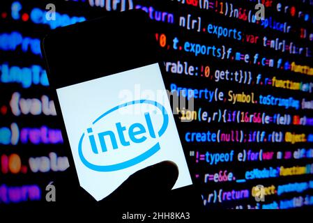 In this photo illustration, the Intel logo seen displayed on a ...