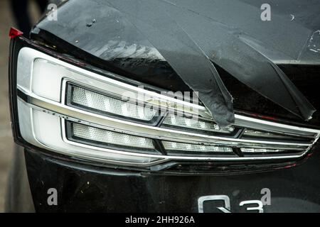 After accident car detailing. Fender varnishing. Arm holding paint ...