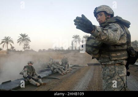 Soldiers build an assault, float bridge outside Camp Taji Stock Photo ...