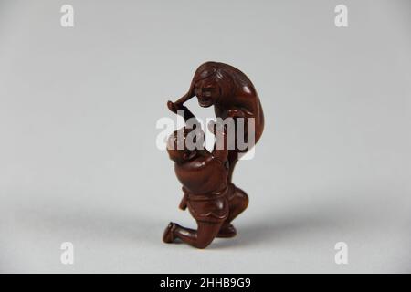 Netsuke of Ghost and Man on His Knees, 19th century Stock Photo - Alamy