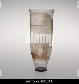 A Roman ribbed glass beaker from the mid-1st century A.D., showcasing ...