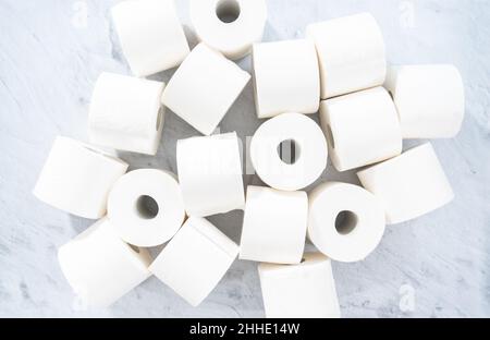 Flat lay. New white toilet paper rolls on a gray background Stock Photo ...
