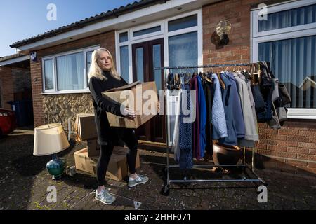 Senior lady with some of her belongings before moving home, England ...