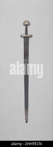 A Frankish sword with a pattern welded blade,7th/8th century A broad ...
