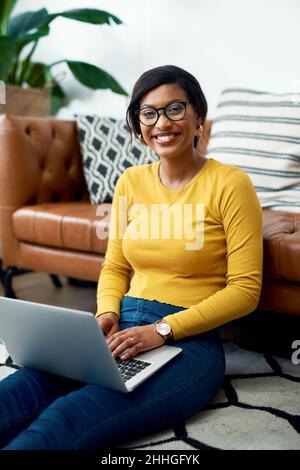 Enjoying the wifi at home. Cropped shot of an adorable little girl ...