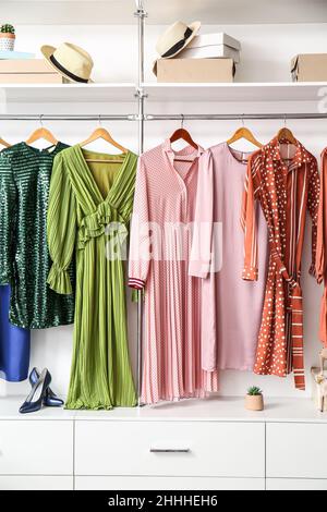 Interior of dressing room with dresses, accessories and sofa Stock ...