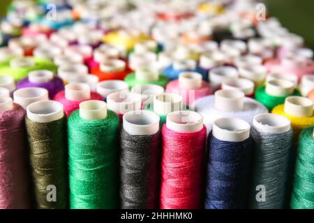 Closeup view of spools with different sewing threads Stock Photo - Alamy
