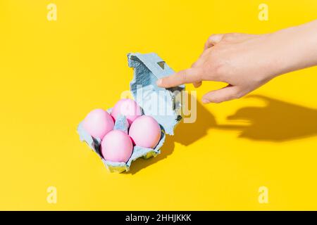 Woman opening cup with Easter pink egg. Religious holiday concept ...