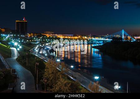 Beautiful view of the illuminated Embankment of Tura River and the ...