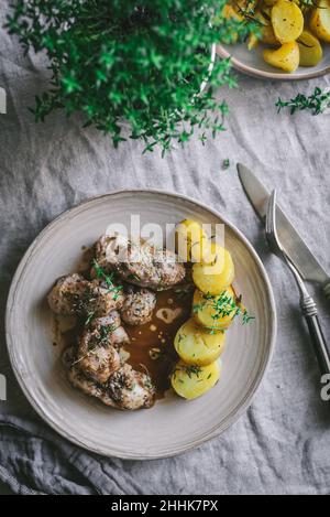 From above of appetizing stew with potatoes and rabbit meat served in ...