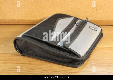 Trapper keeper type binder on desk Stock Photo - Alamy