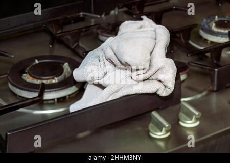 Gas stove and towel in a kitchen Stock Photo - Alamy