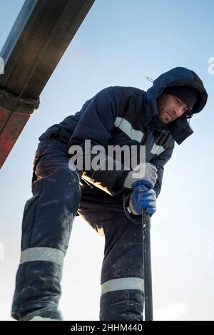 A frozen block of ice on a metal surface Stock Photo - Alamy
