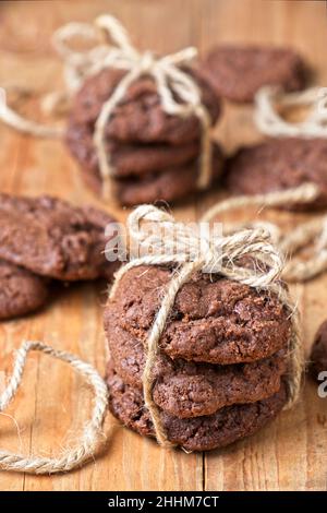 Close up of stacked choc chip cookies tied together with string ...