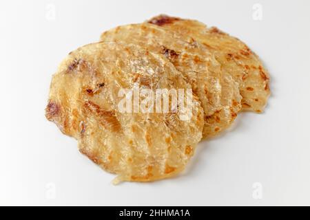 Dried filefish fillet on white background Stock Photo - Alamy
