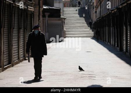A citizen walks the empty street of Venice during lockdown for ...