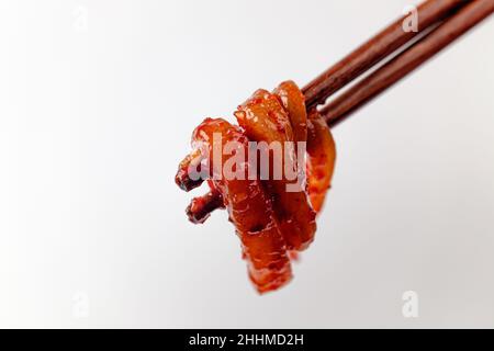 pickled squid on a white background Stock Photo - Alamy