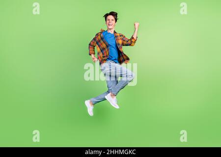 Full size profile photo of funny brunet millennial guy jump wear shirt ...