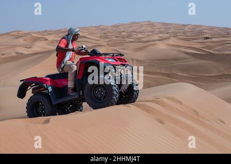 ATV Riding and Dune Bashing on a Desert Safari in Dubai, UAE Stock ...