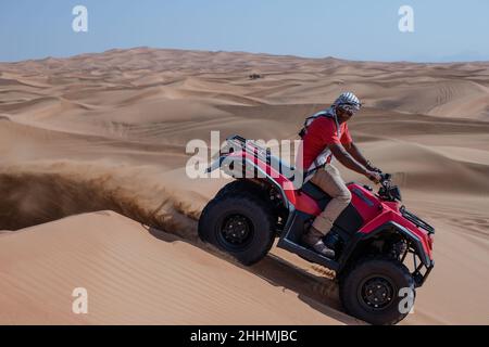 ATV Riding and Dune Bashing on a Desert Safari in Dubai, UAE Stock ...