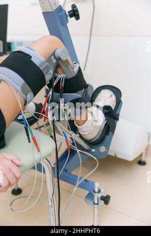Patient on Continuous Passive Range of Motion machines. Device to ...