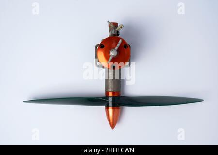A small gasoline engine with a propeller for a controlled model of an ...