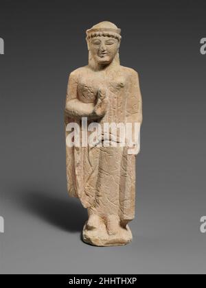 Sculpture of a maiden (kore) in marble with pigments of various colours ...