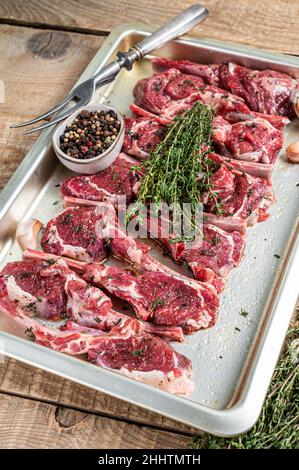 Raw mutton meat for chops steaks, uncooked rack of lamb on steel tray ...