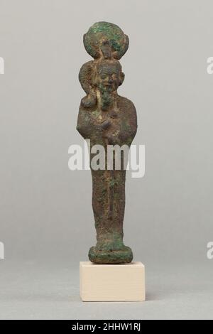 This figure represents the child god Horus, wearing the Amonian crown ...