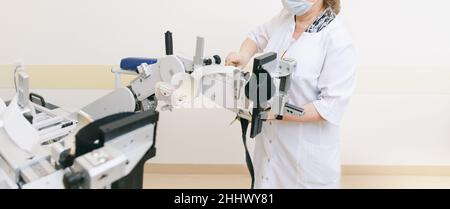 Patient on Continuous Passive Range of Motion machines. Device to ...