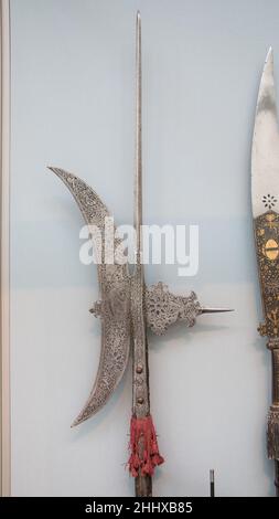 A European halberd with axe-like blade and spear point, used for combat ...